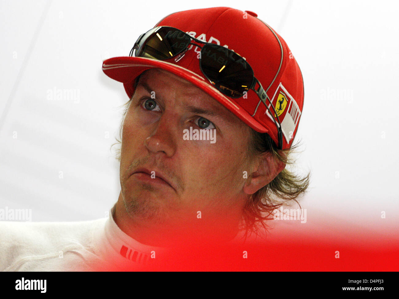 Finnish Formula One driver Kimi Raikkonen of Scuderia Ferrari grimaces ...