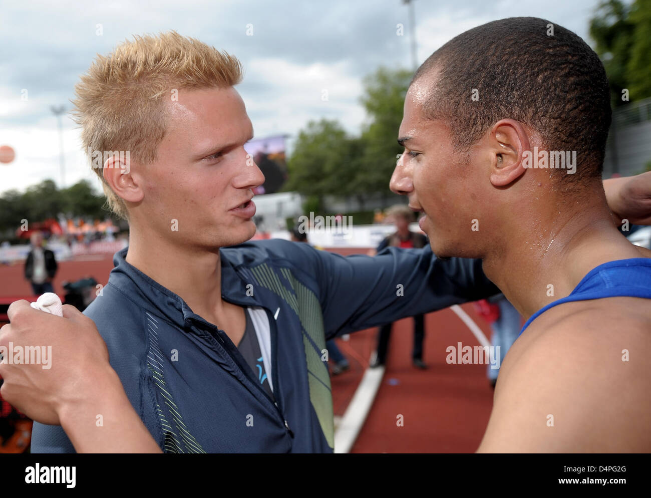 German decathletes Pascal Behrenbruch (L) and Norman Mueller (R) hug at ...