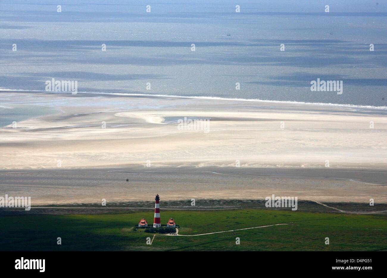 The picture shows the Wadden Sea and the lighthouse of Westerhever ...