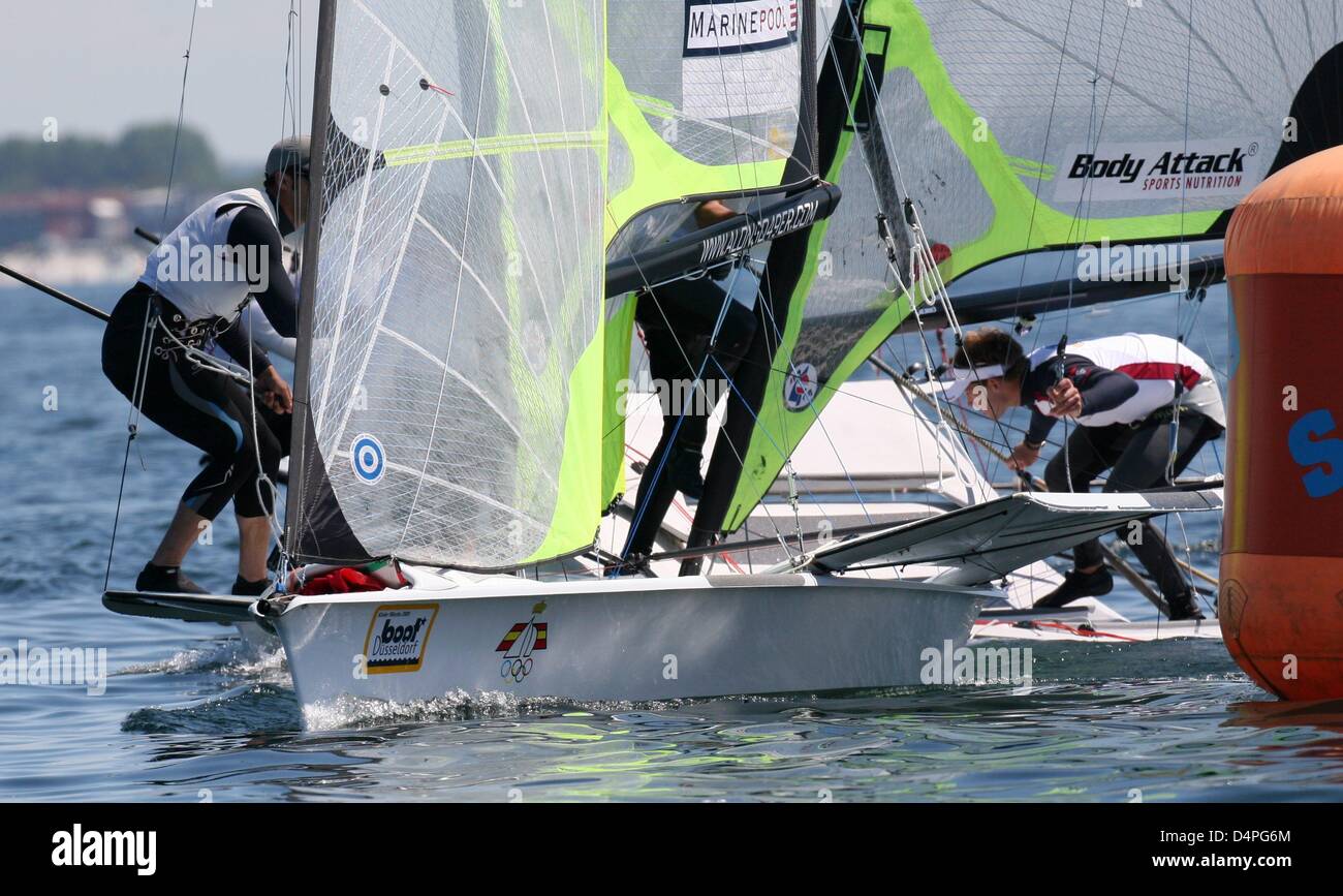 49er class boats compete during a race at the Kiel Week sailing event ...