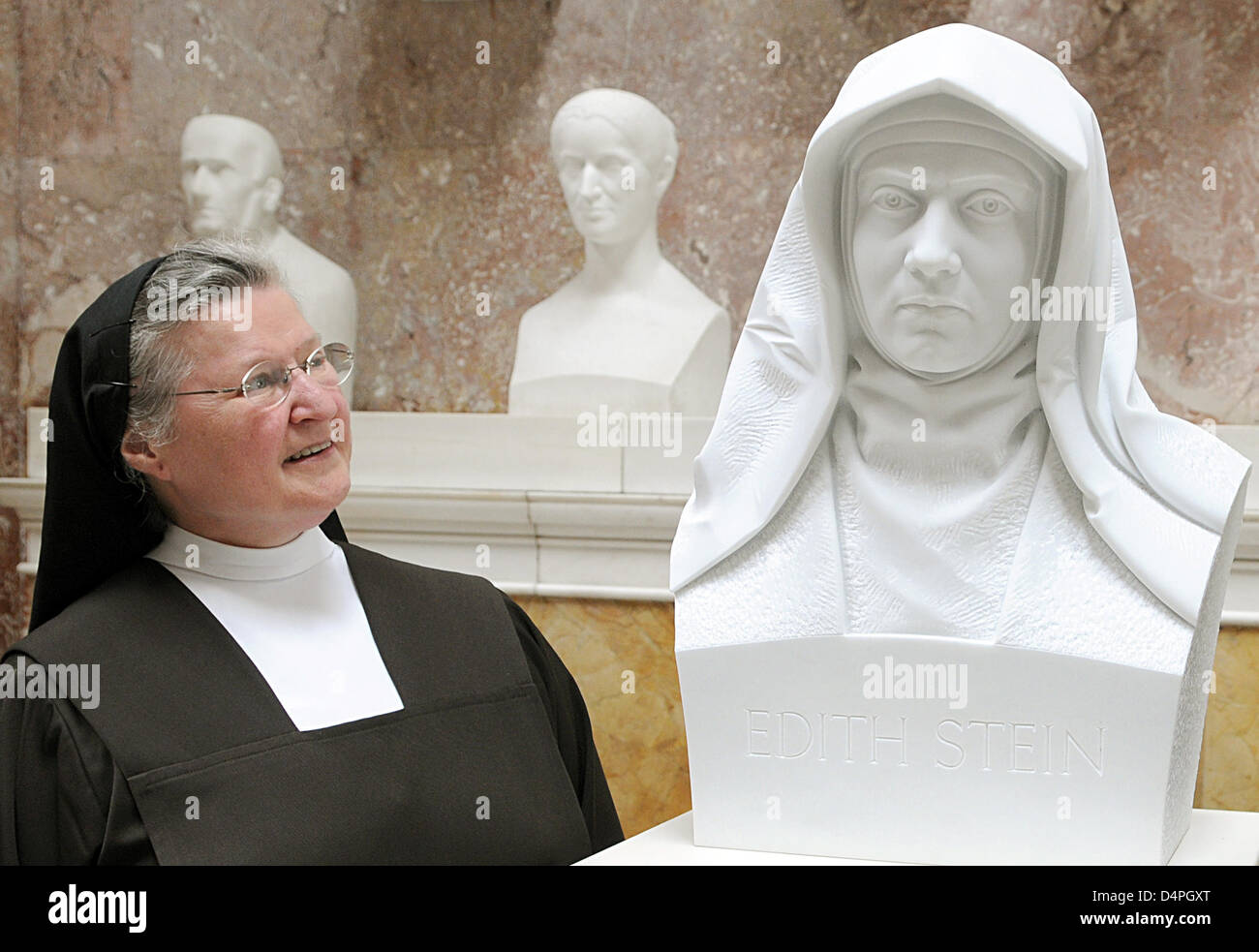 A nun eyes the bust of nun Edith Stein, murdered by the Nazis and later ...