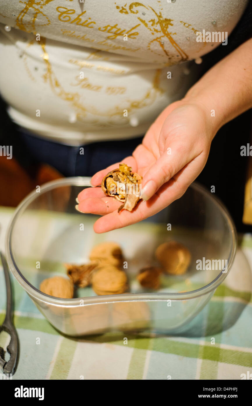 hands breaking nuts Stock Photo - Alamy