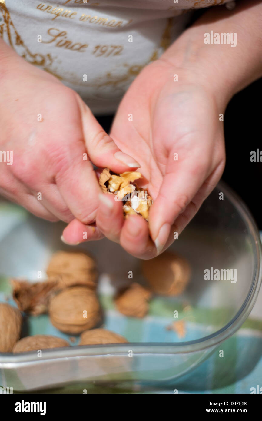 hands breaking nuts Stock Photo - Alamy