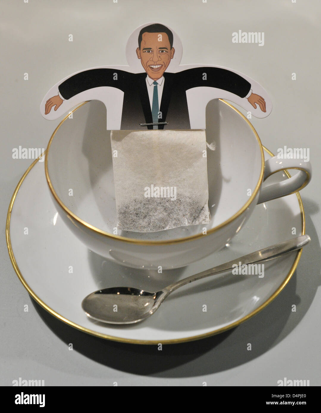 A tea bag mount designed after US President Barack Obama in a tea cup ...