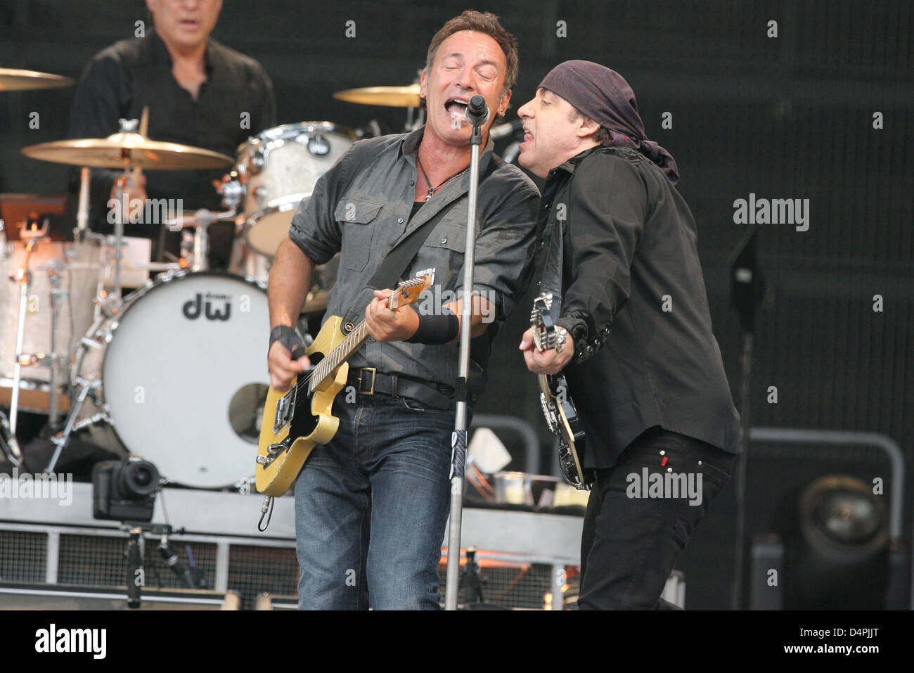 US singer Bruce Springsteen (C) performs with guitarist Steve van Zandt ...
