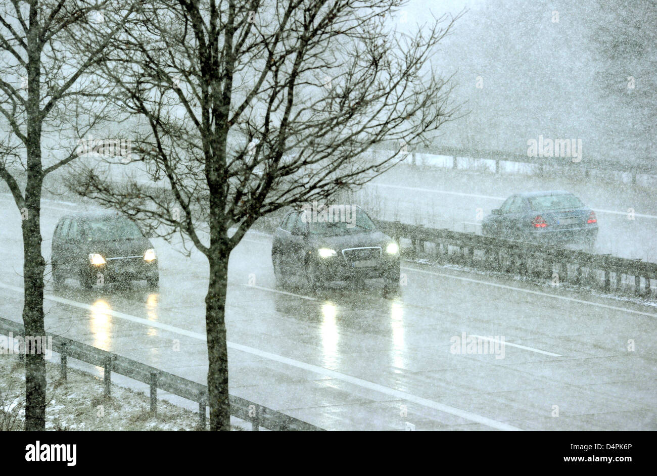 People drive alonmg the motoway 352 during heavy snowfall near Hanover ...