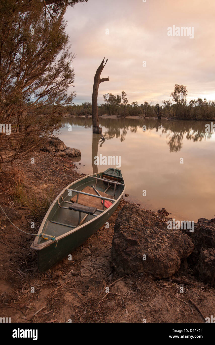 Balonne River with pink clouds of dusk reflected in calm waters near St ...