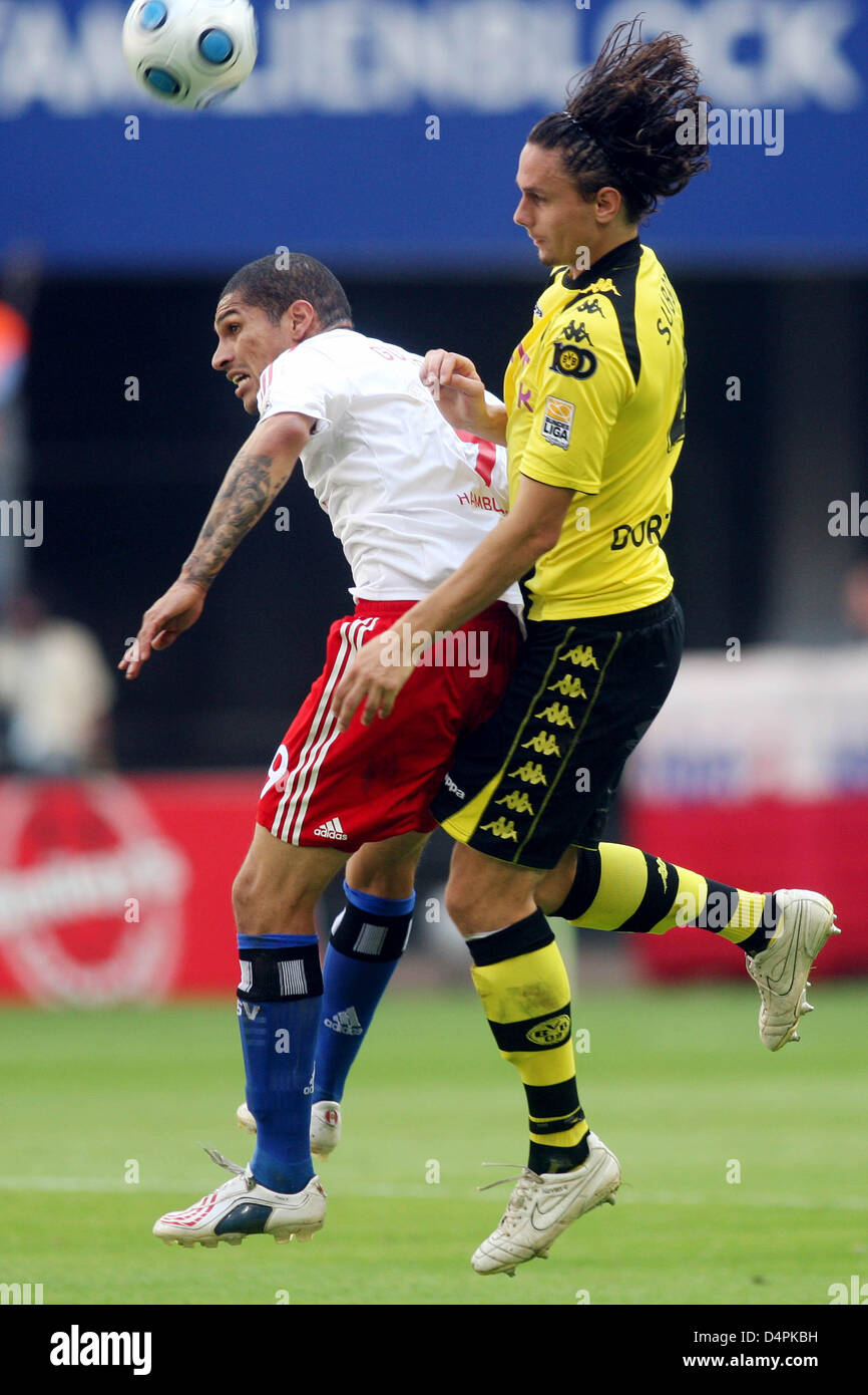 Hamburg?s Peolo Guerrero (L) and Dortmund?s Neven Subotic (R) rise for ...