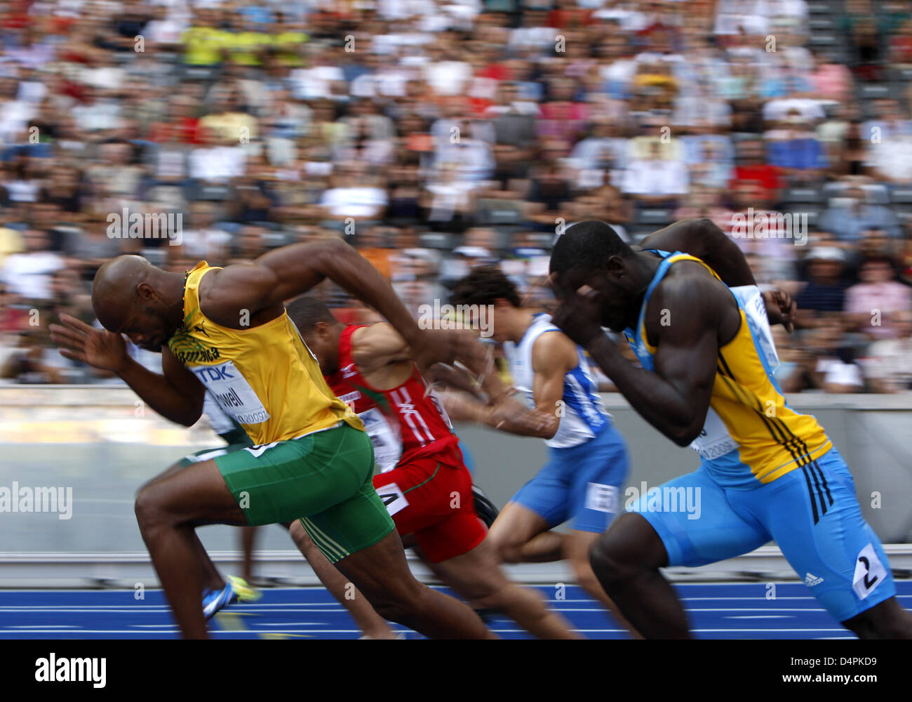 Jamaica?s Asafa Powell (L) competes in a 100m heat at the 12th IAAF ...