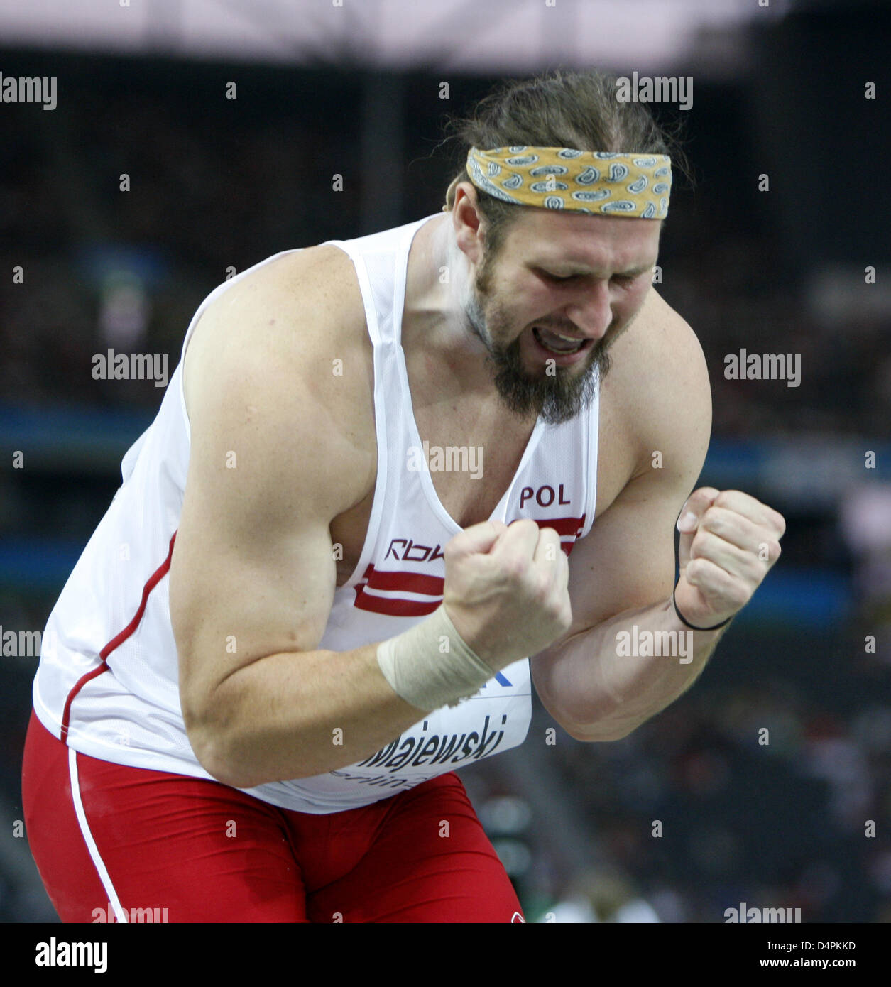 Polish Tomasz Majewski cheers after an attempt during the shot put ...