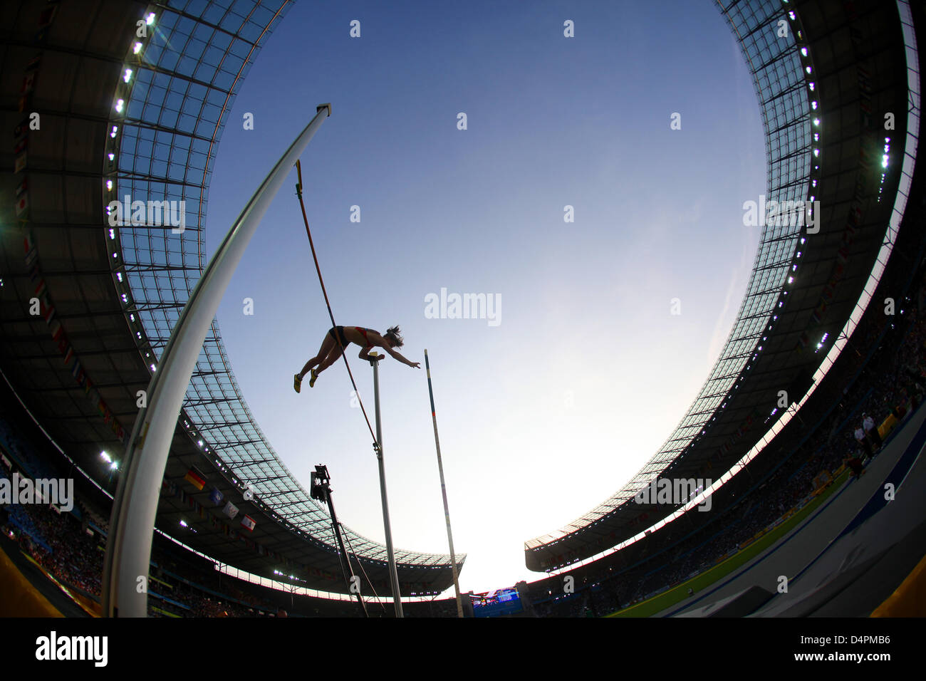 Germany?s Silke Spiegelburg clears the bar during the Pole Vault final ...