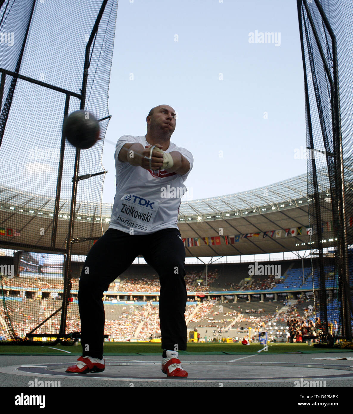 Poland?s Szymon Ziolkowski spins during an attempt in the Hammer Throw ...