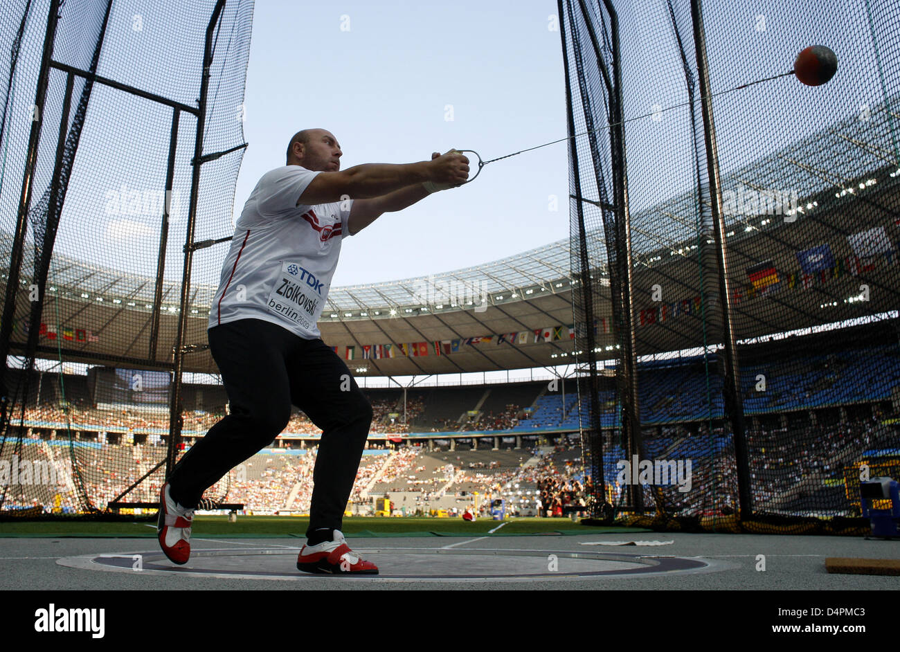 Poland?s Szymon Ziolkowski spins during an attempt in the Hammer Throw ...