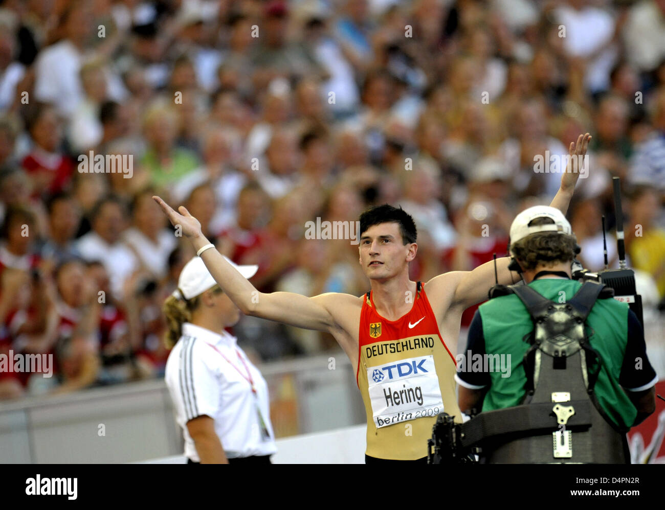 German Robert Hering animates the crowd prior to the men?s 200m semi ...