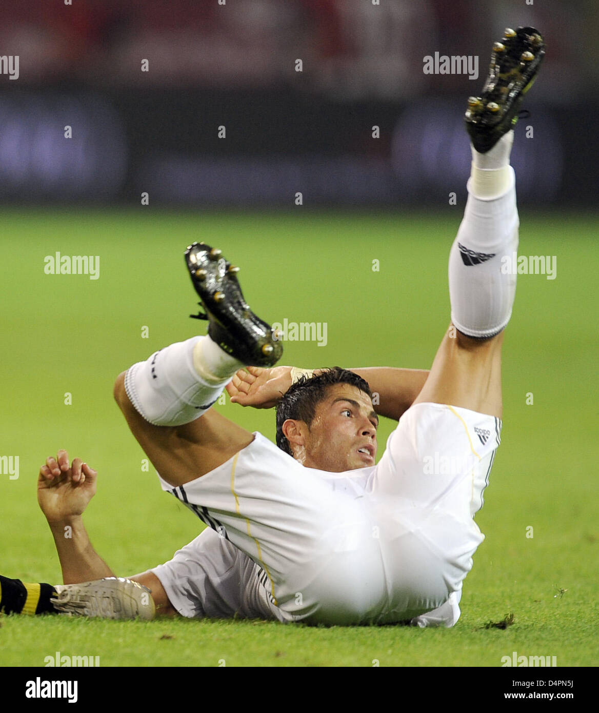 Madrid?s Cristiano Ronaldo lies on the pitch during the friendly match ...