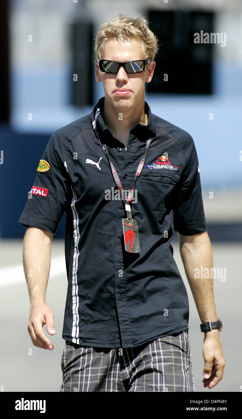German Formula One driver Sebastian Vettel of Red Bull Racing walks ...