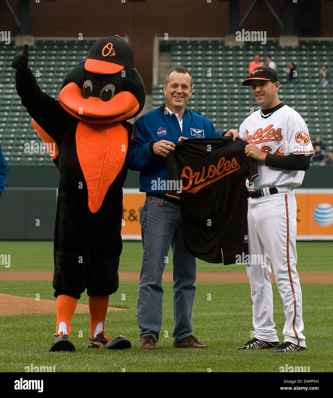 NASA astronaut Richard Arnold threw the ceremonial first pitch at an ...