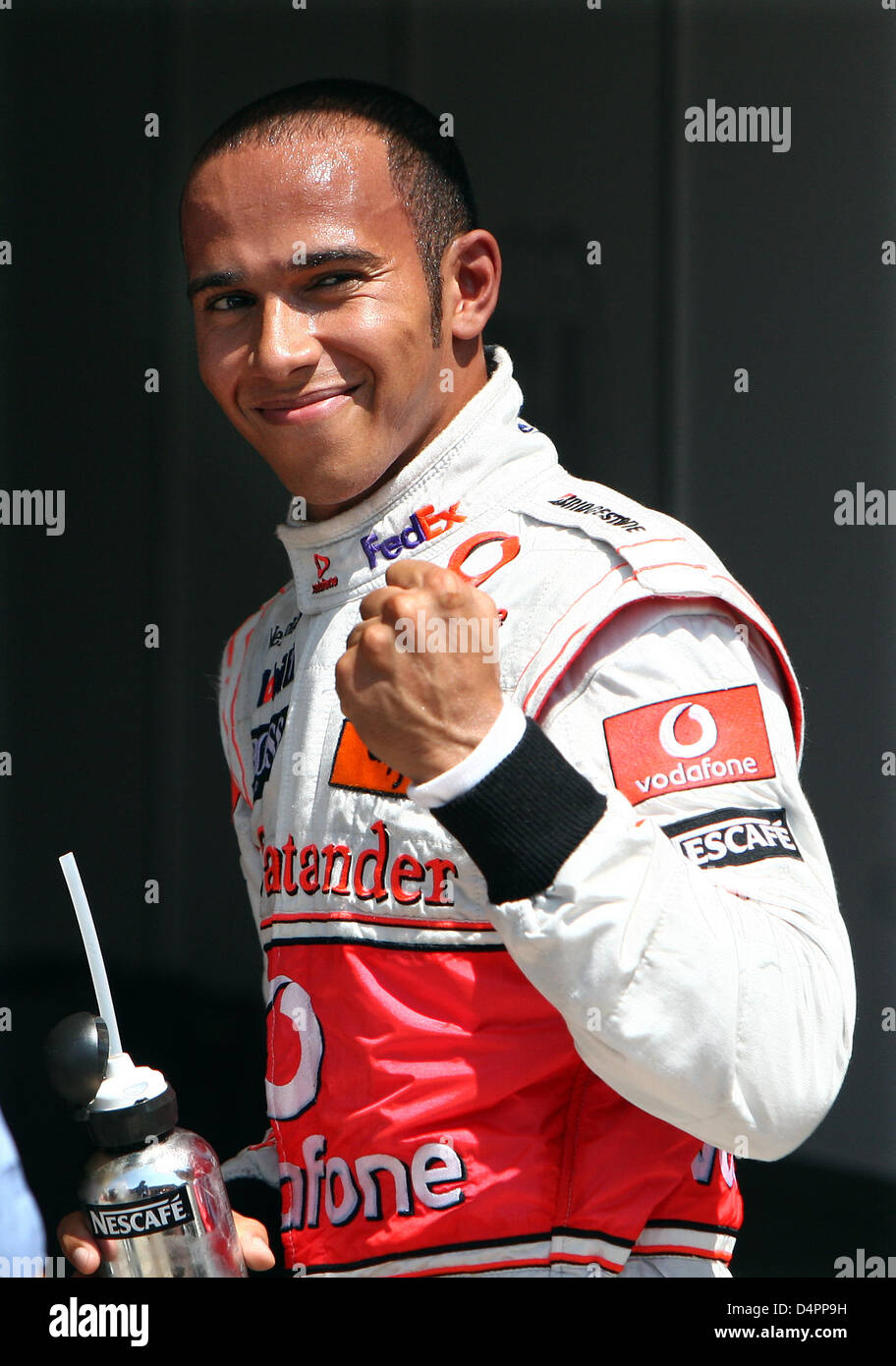 British Formula One driver Lewis Hamilton of McLaren Mercedes cheers ...