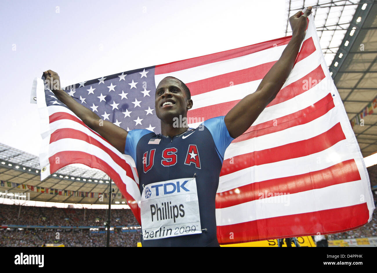 Dwight Phillips of the US celebrates winning the gold medal in the Long ...