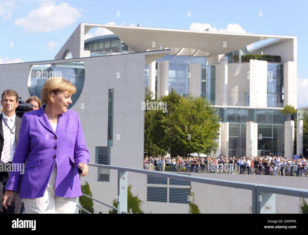 German Chancellor Angela Merkel (C) smiles during the federal ...