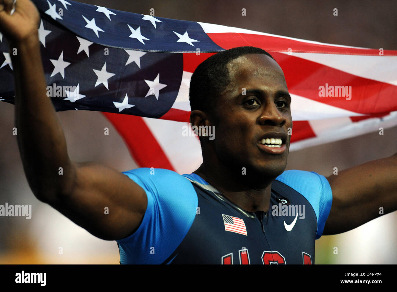 Dwight Phillips of the US celebrates winning the gold medal in the Long ...