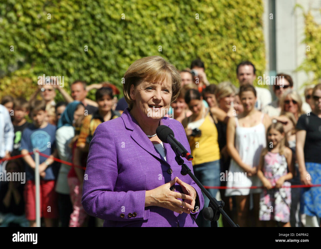 German Chancellor Angela Merkel welcomes visitors during the annual ...