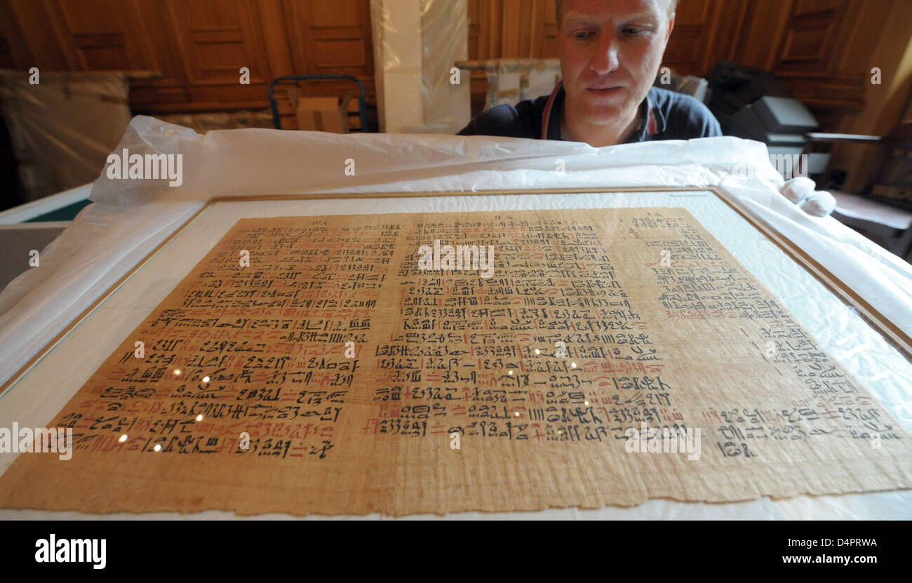 Head restorer Joerg Graf looks at the text of the ?Ebers Papyrus ? in ...