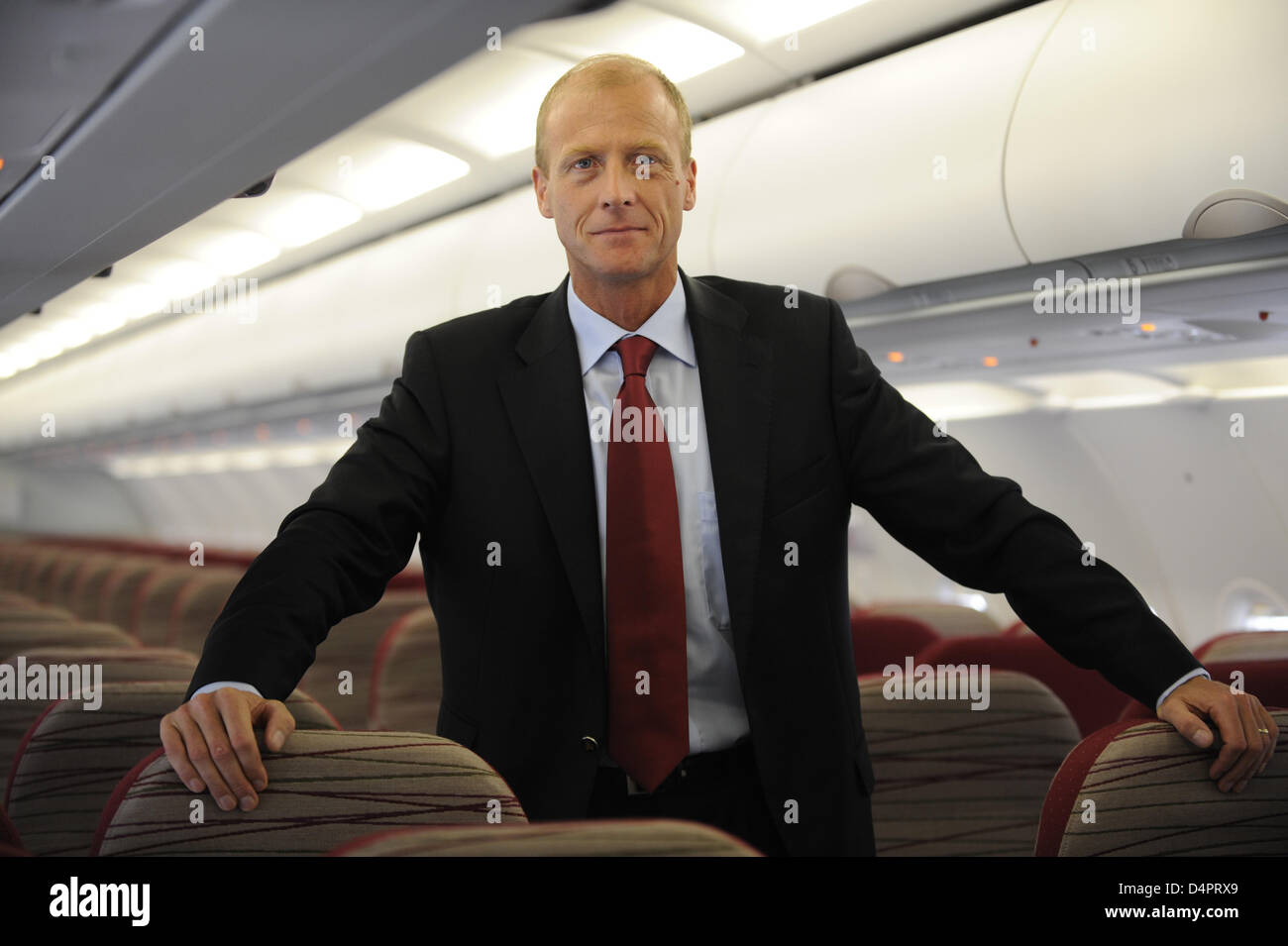 Tom Enders, CEO of Airbus, poses inside an Airbus A319 in Hamburg ...