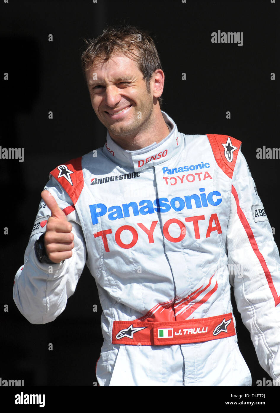 Italian Formula One driver Jarno Trulli of Toyota cheers after winning ...