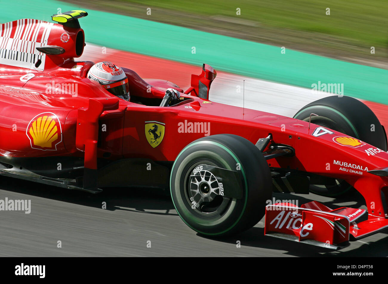 Finnish Formula One driver Kimi Raikkonen of Ferrari steers his car ...