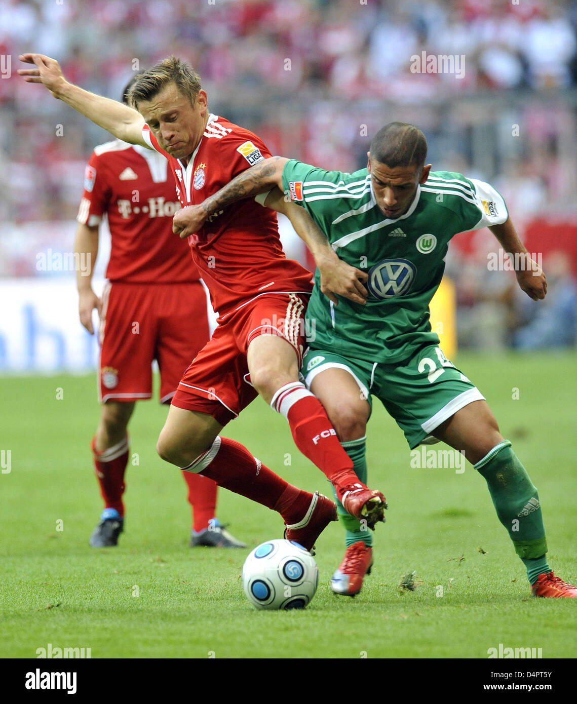 Bayern Munich?s Ivica Olic (L) vies for the ball with Wolfsburg?s ...