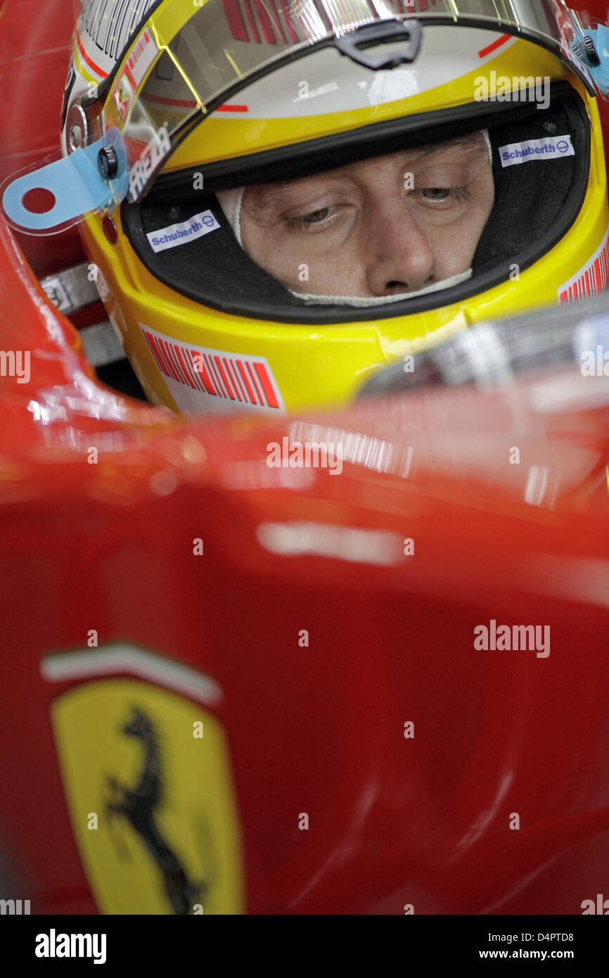 Italian Formula One driver Luca Badoer of Ferrari sits in his car at ...