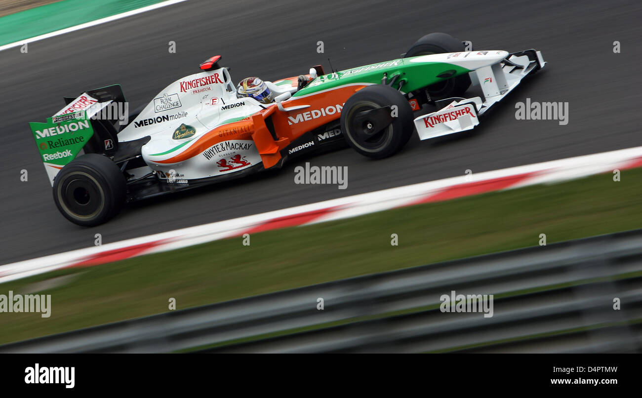 German Formula One driver Adrian Sutil of Force India steers his car ...