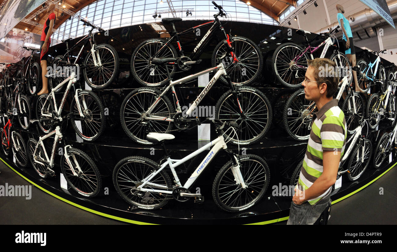 A visitor examines mountain bikes of the company Merida at the ...