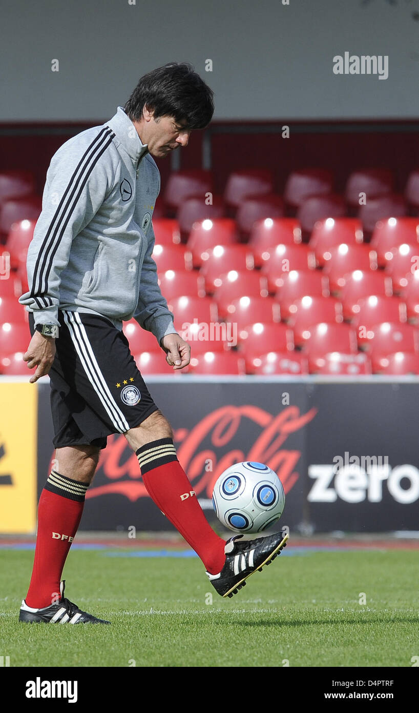 The coach of the German national soccer team Joachim Loew juggles a ...