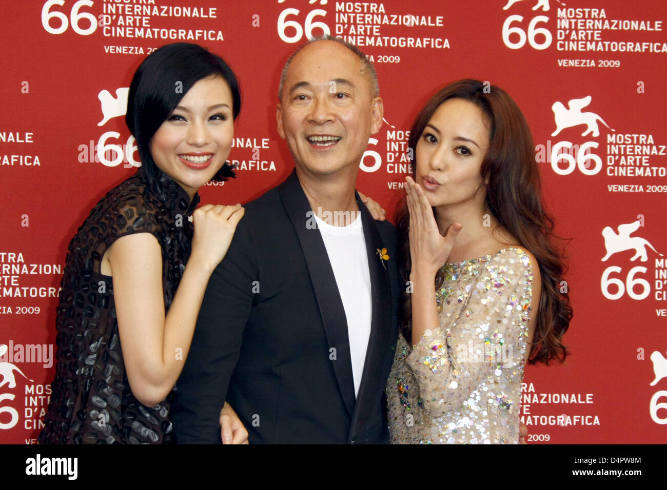 Actresses Terri Kwan (R) and Xuan Zhu pose with director Yonfan Manshih ...