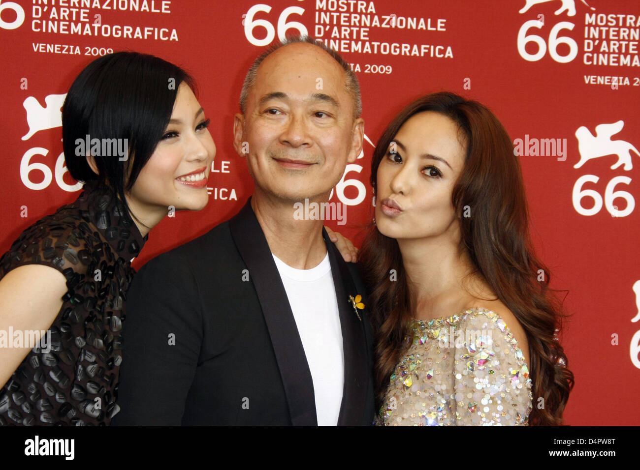 Actresses Terri Kwan (R) and Xuan Zhu pose with director Yonfan Manshih ...