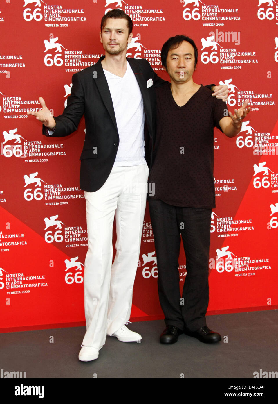 Eric Bossick and director Shinya Tsukamoto (R) smiles after the press ...
