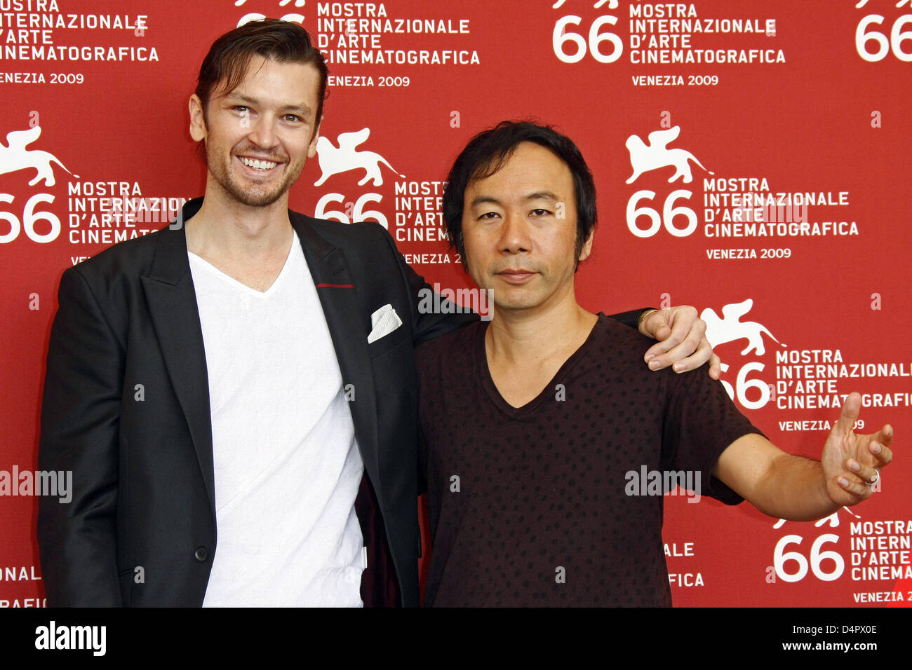 Eric Bossick and director Shinya Tsukamoto (R) smiles after the press ...