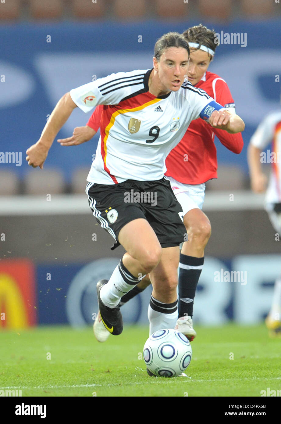 Germany?s Birgit Prinz (L) and Norway?s Ingvild Stensland vie for the ...