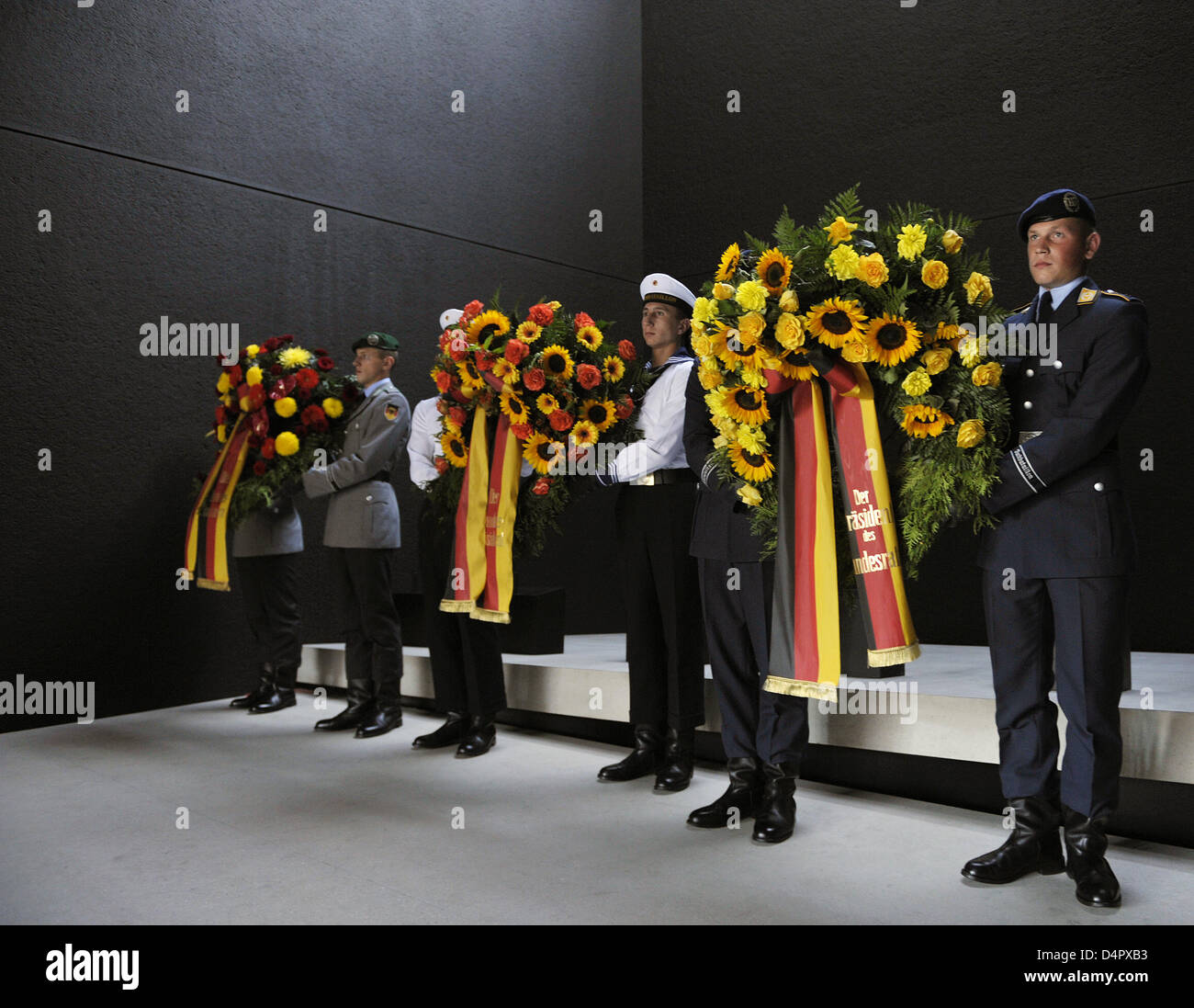 German soldiers lay wreaths during the inauguration ceremony for the ...