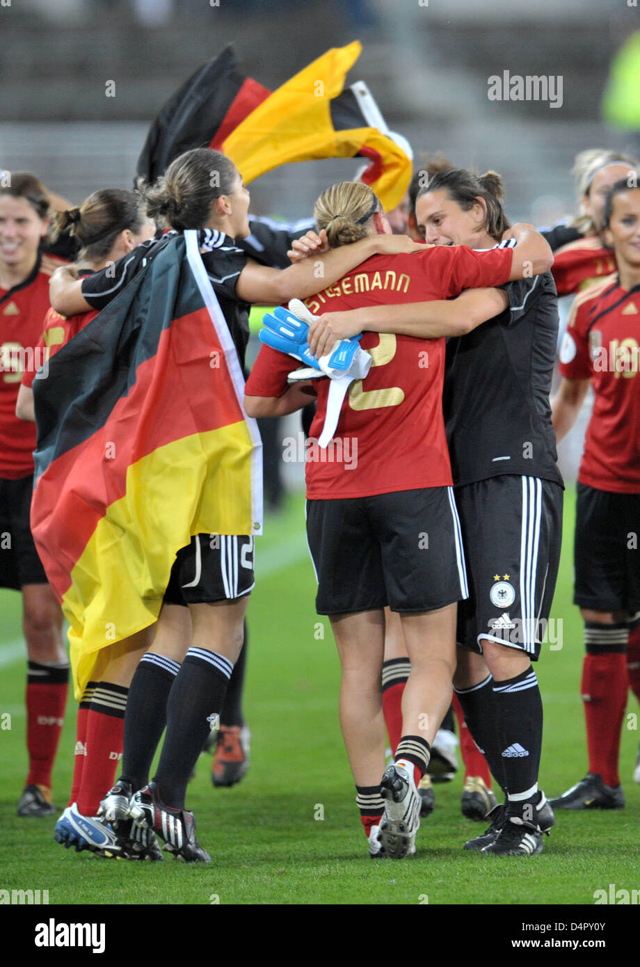 Germany?s goalie Nadine Angerer (R) embraces Kerstin Stegemann (C ...
