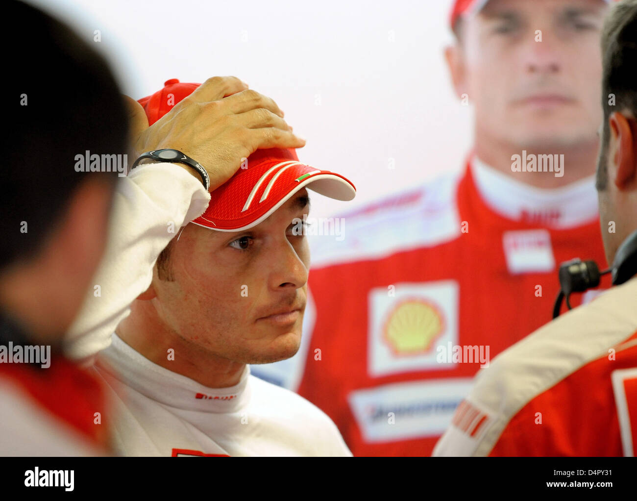 Italian Formula One driver Giancarlo Fisichella (C) of Scuderia Ferrari ...