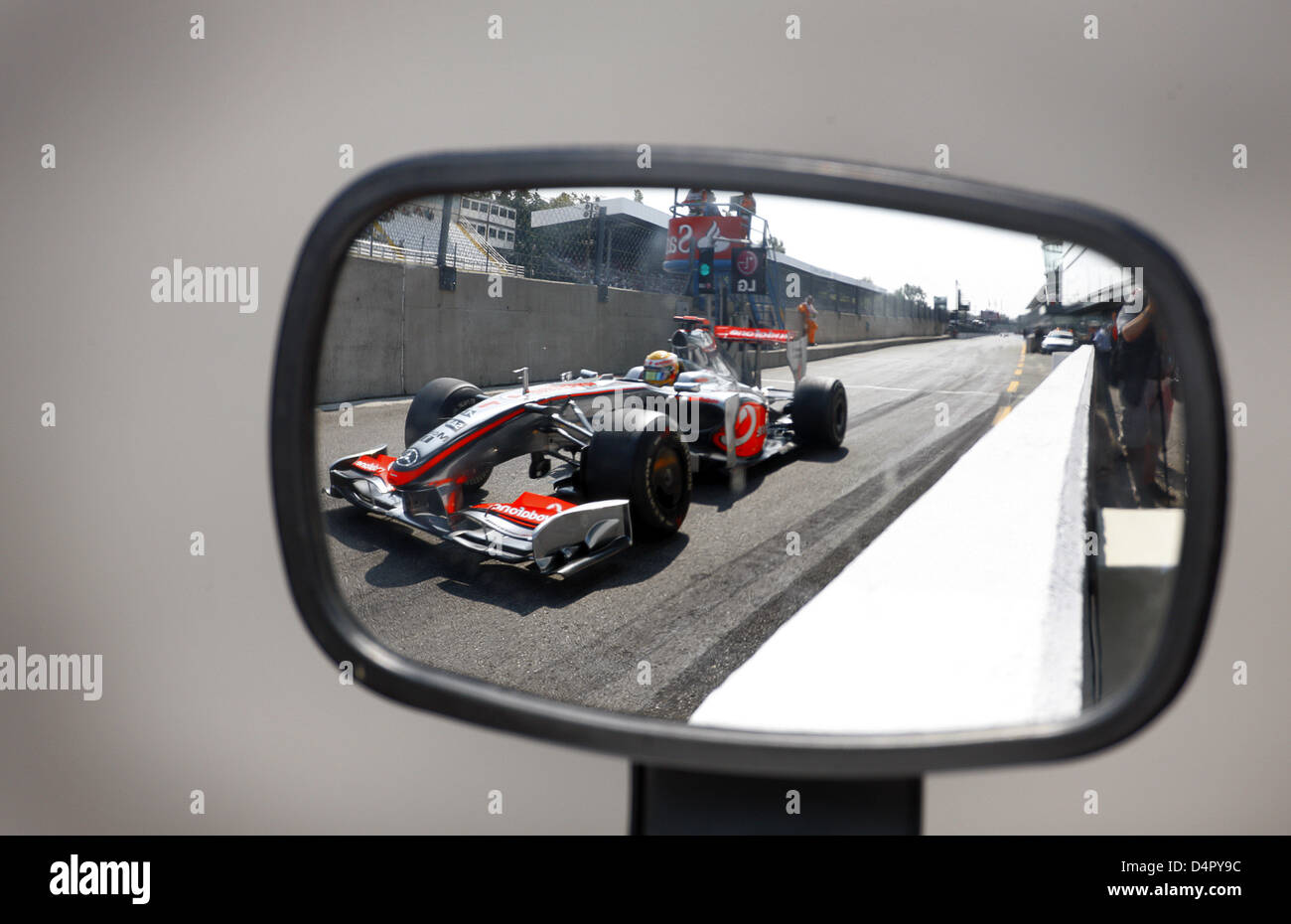 British Formula One driver Lewis Hamilton of McLaren Mercedes mirrors ...