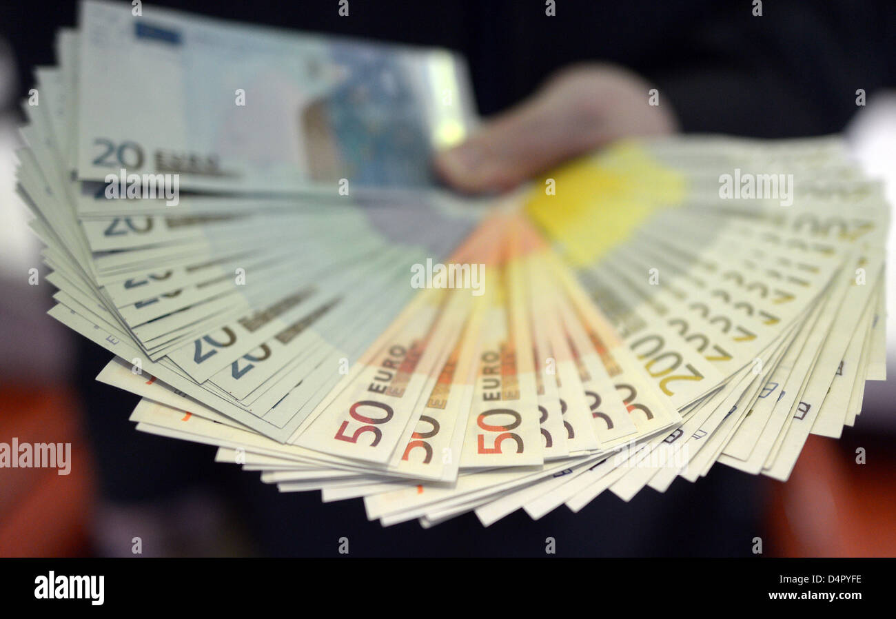 A person presents counterfeit euro notes in Duesseldorf, Germany, 18 ...