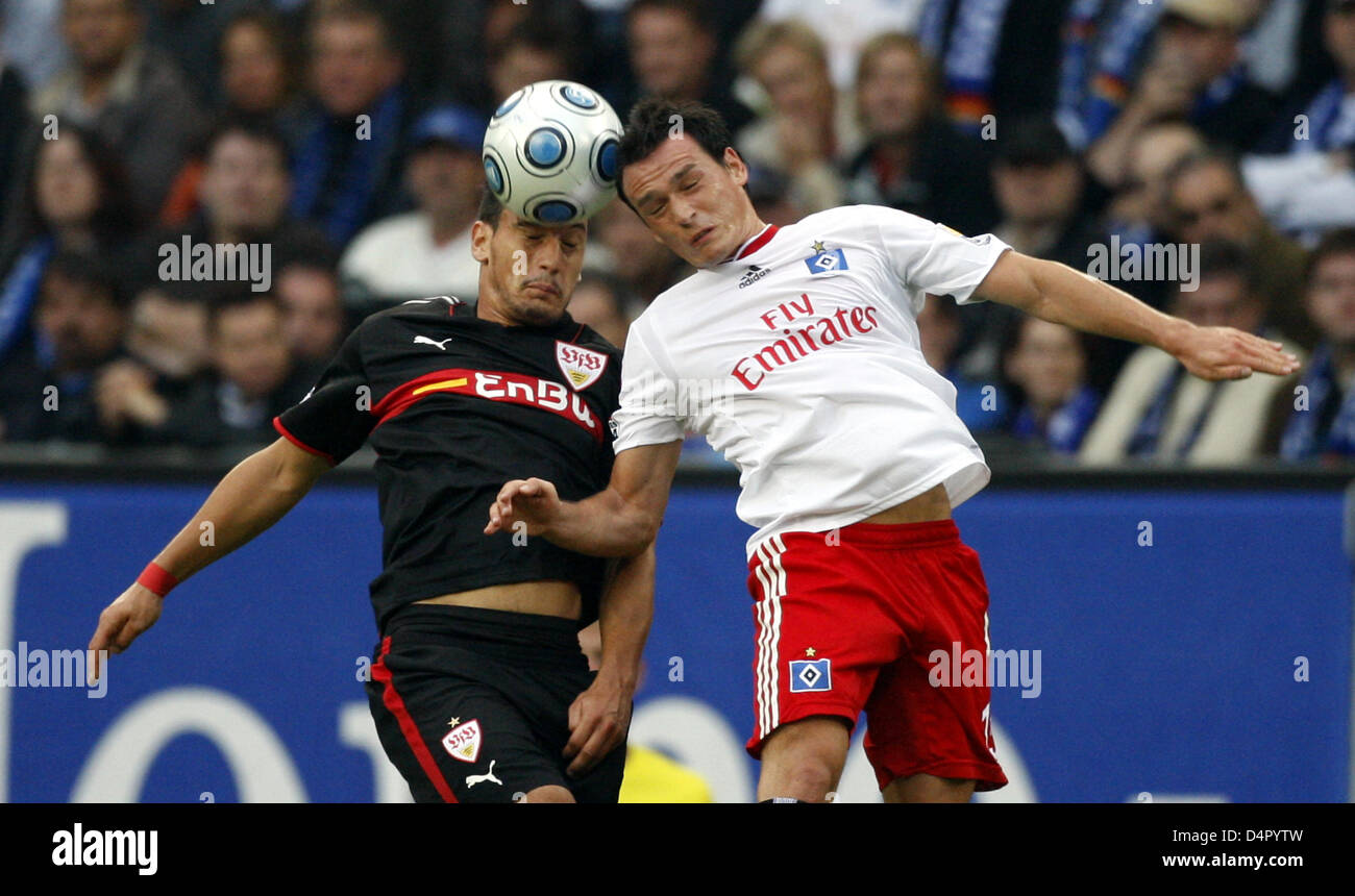 Hamburg?s Piotr Trochowski (R) and Stuttgart?s Timo Gebhart (L) rise ...