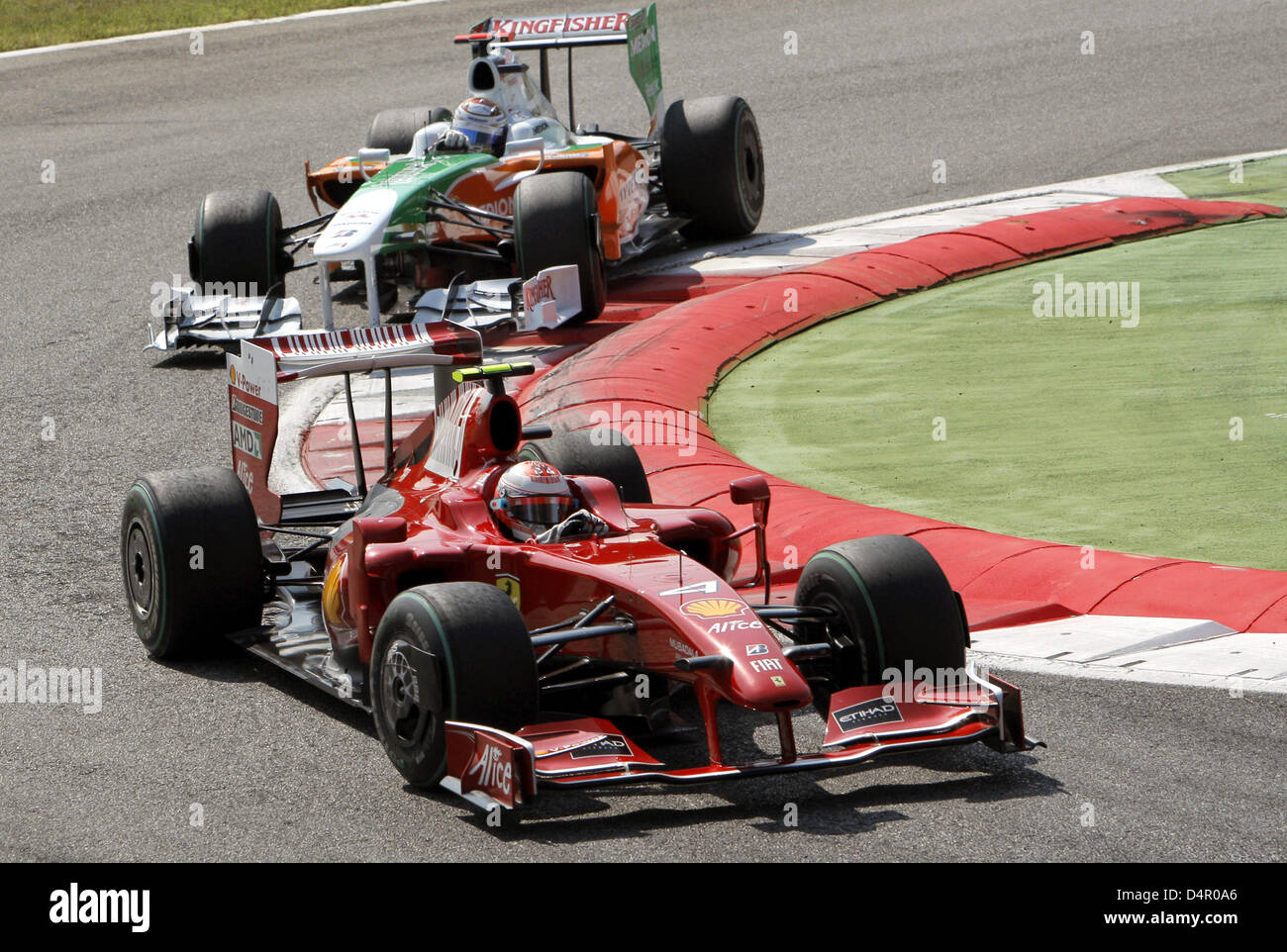 Finnish Formula One driver Kimi Raokkonen (front) of Scuderia Ferrari ...