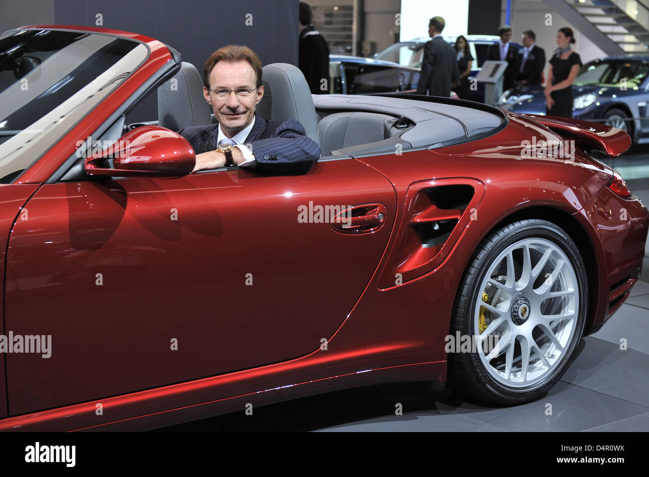 Porsche CEO Michael Macht poses with a Porsche ahead of the upcoming ...