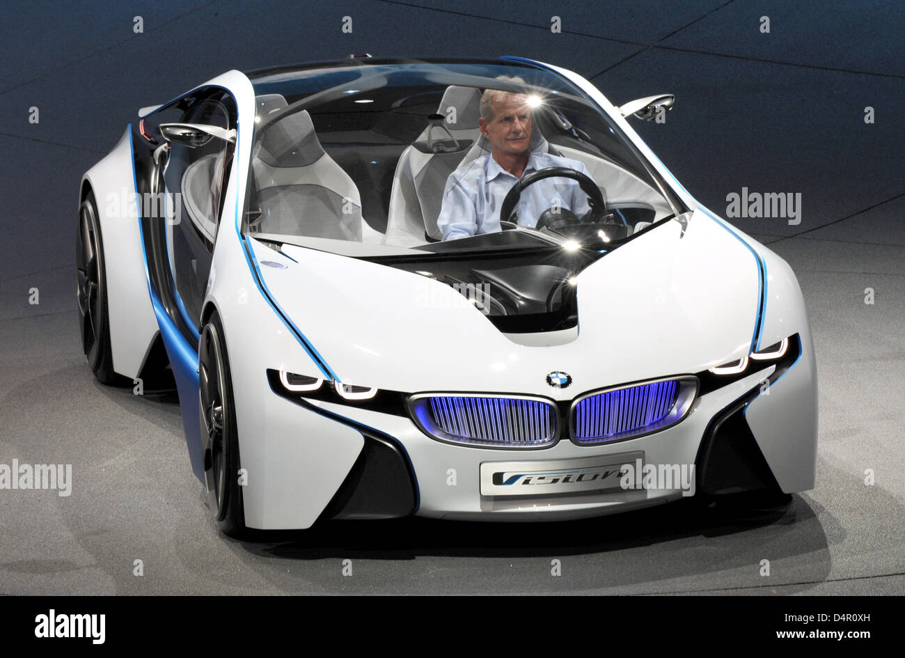 BMW CEO Norbert Reithofer poses in a BMW Vision ahead of the upcoming ...