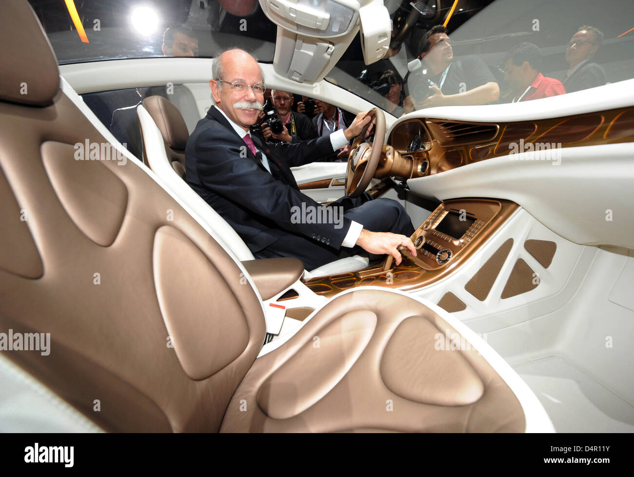 Daimler CEO Dieter Zetsche poses in a Mercedes Concept Blue Zero E-Cell ...